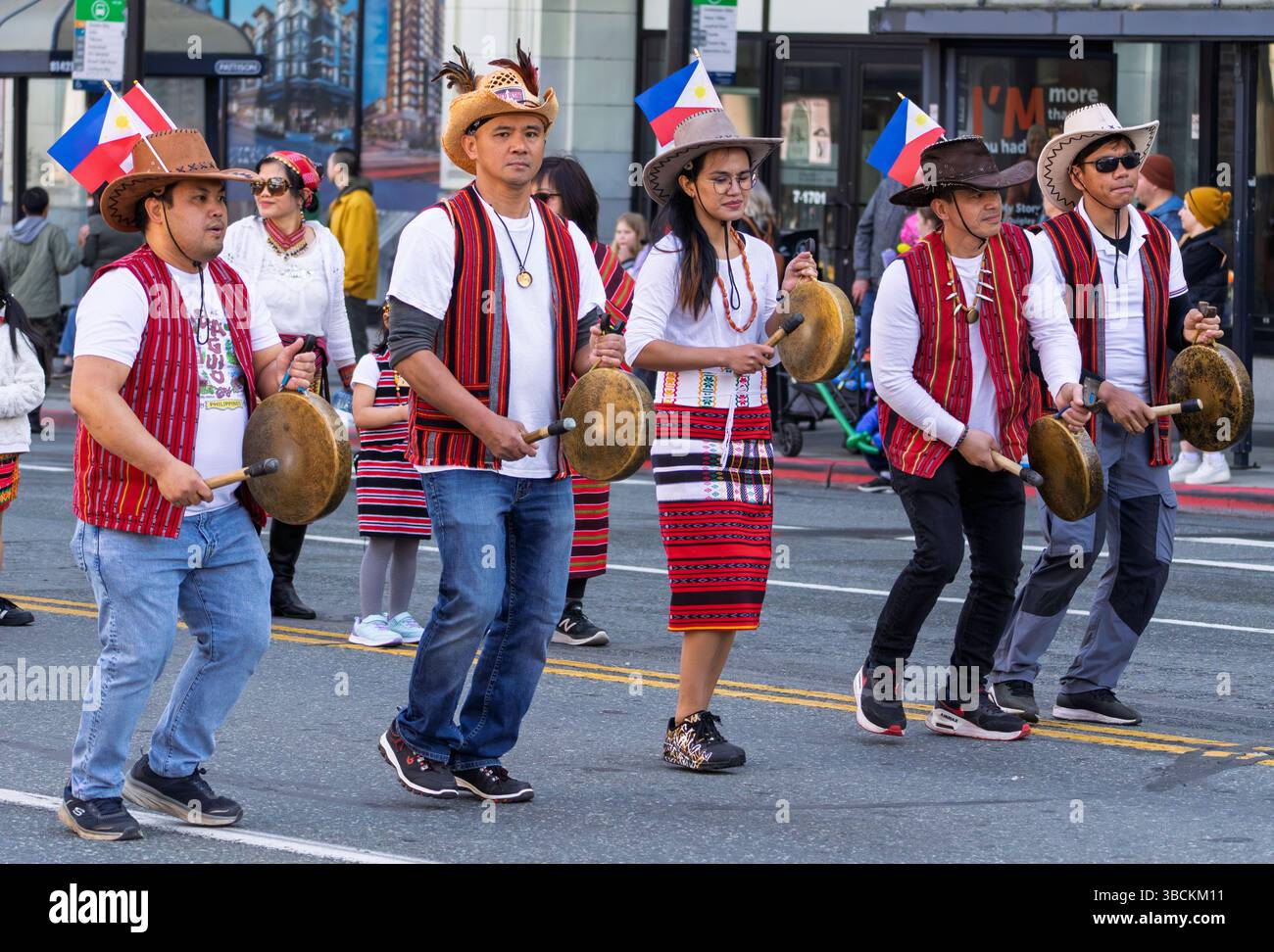 Drummers from the Philippine community march at the Victoria Day Parade ...