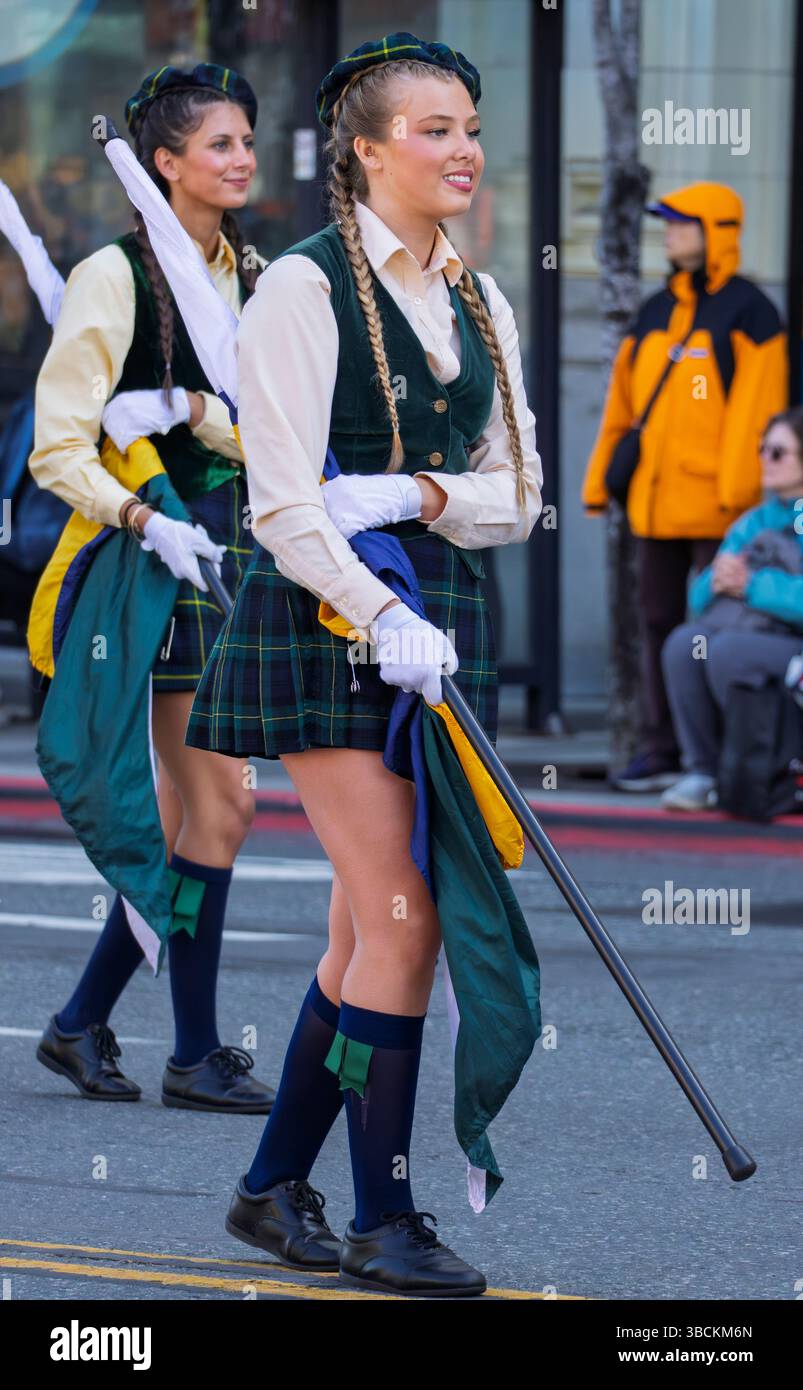 A flag bearer at the Victoria Day Parade on May 19, 2025 in Victoria ...