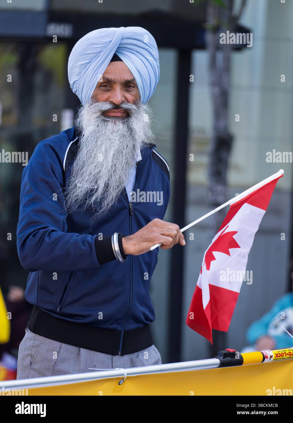 A Sikh man with a Canadian flag at the Victoria Day Parade on May 19 ...