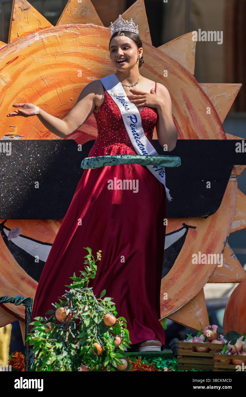 Miss Penticton rides a peach-themed float at the Victoria Day Parade on May 19, 2025 in Victoria ...