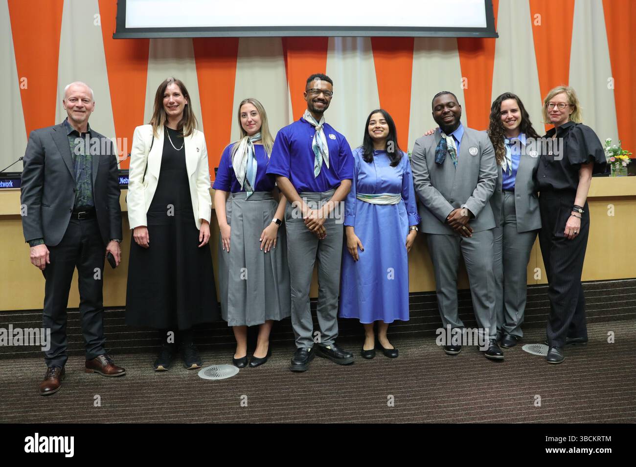 New York, NY - May 19, 2025: UN Tour Guides Uniform models. Global ...