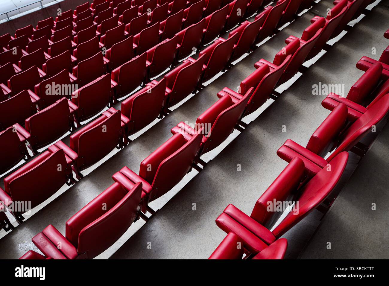 Football vip seats. Red seats in the stadium Stock Photo - Alamy