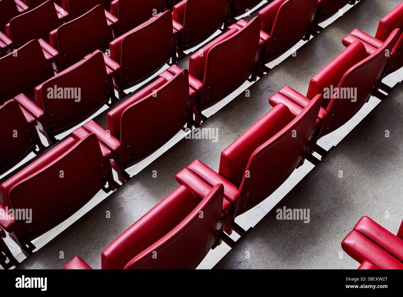 Football vip seats. Red seats in the stadium Stock Photo - Alamy
