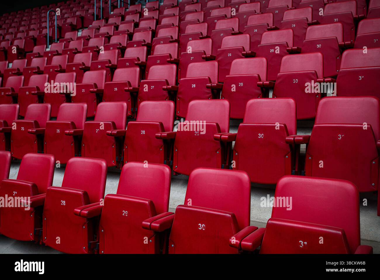 Football vip seats. Red seats in the stadium Stock Photo - Alamy