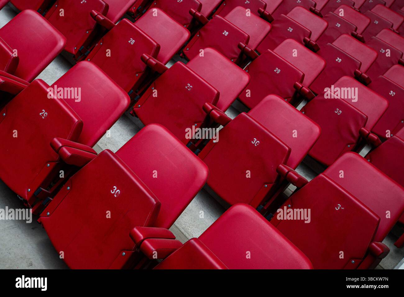 Football vip seats. Red seats in the stadium Stock Photo - Alamy