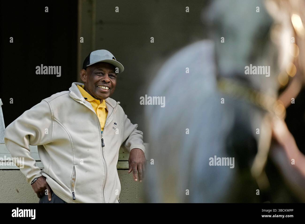 FILE - Trainer Larry Demeritte watches as Kentucky Derby entrant West ...