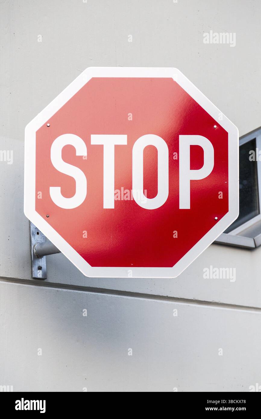 German stop sign on a concrete wall Stock Photo - Alamy