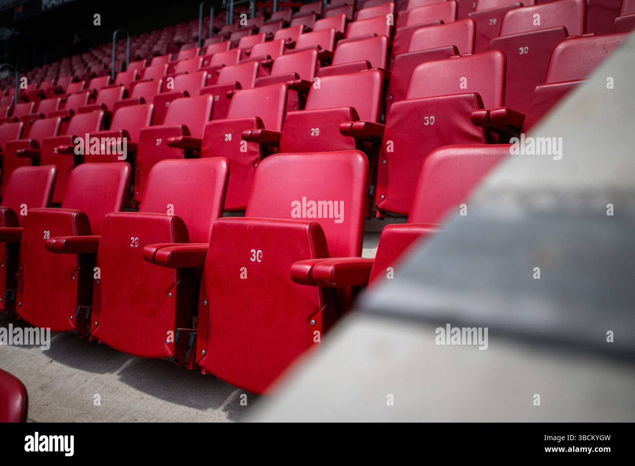 Football vip seats. Red seats in the stadium Stock Photo - Alamy