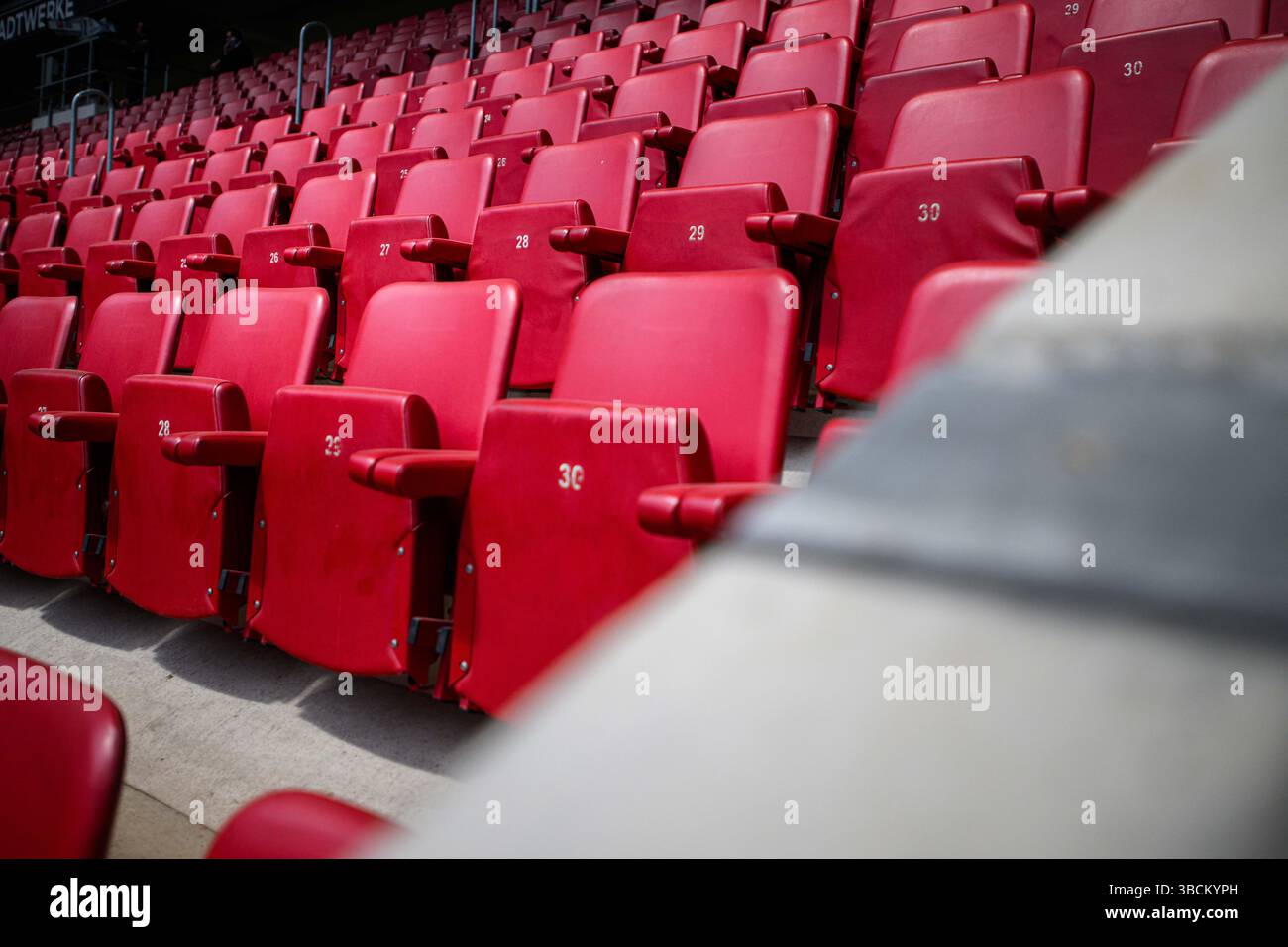 Football vip seats. Red seats in the stadium Stock Photo - Alamy
