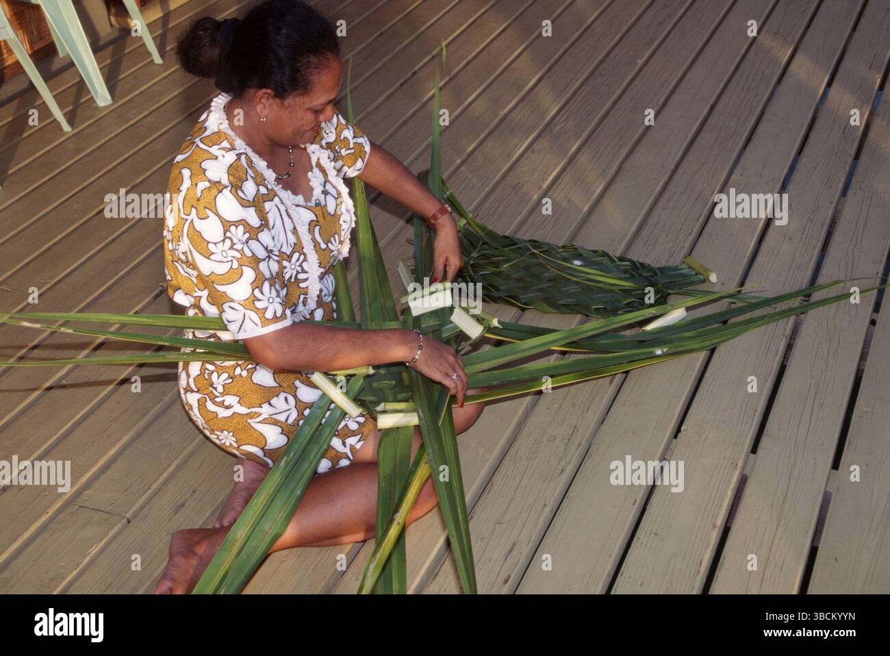 Woman weaving palm leaves, Tahiti, French Polynesia, Oceania Stock ...