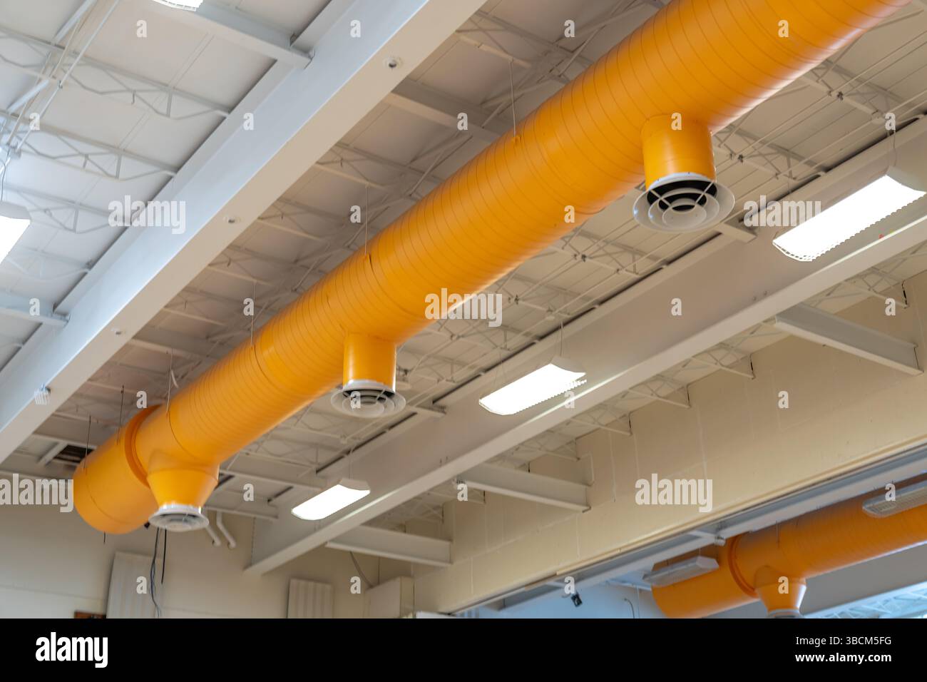 Interior building HVAC, mechanical systems, orange duct, ventilation ...