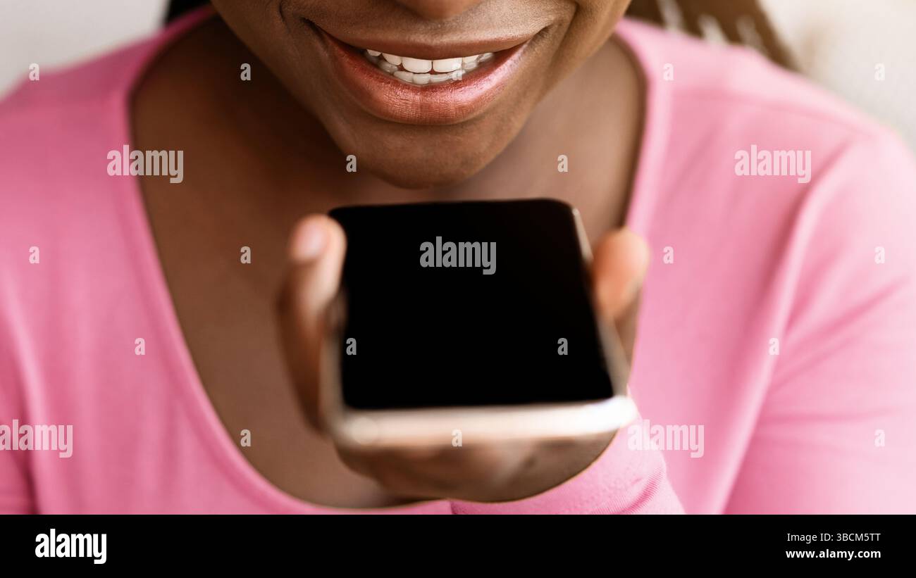 Voice Search Concept. Black woman using personal assistant app on ...