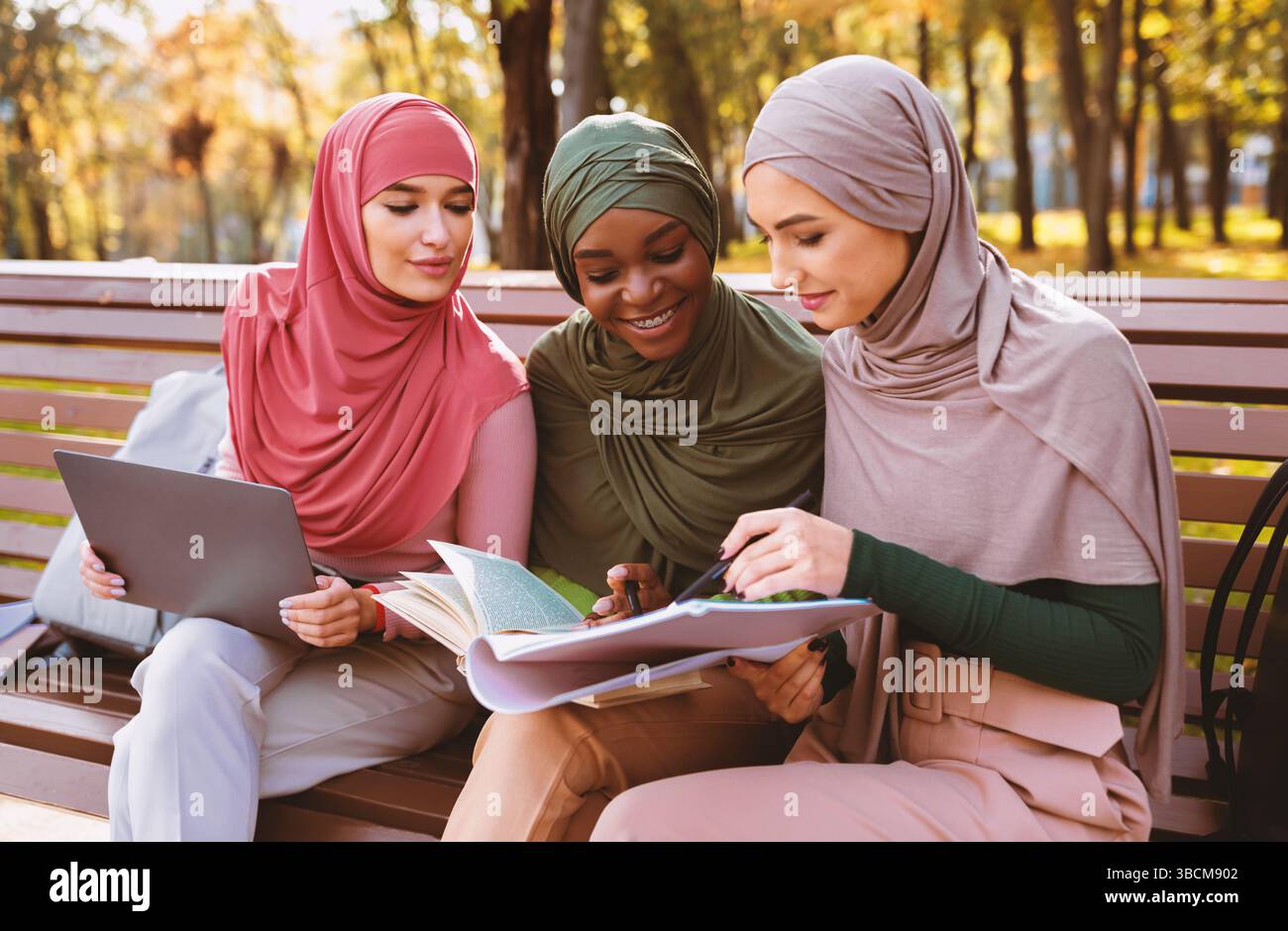 Three Muslim Students Women Learning Together Using Computer Sitting ...
