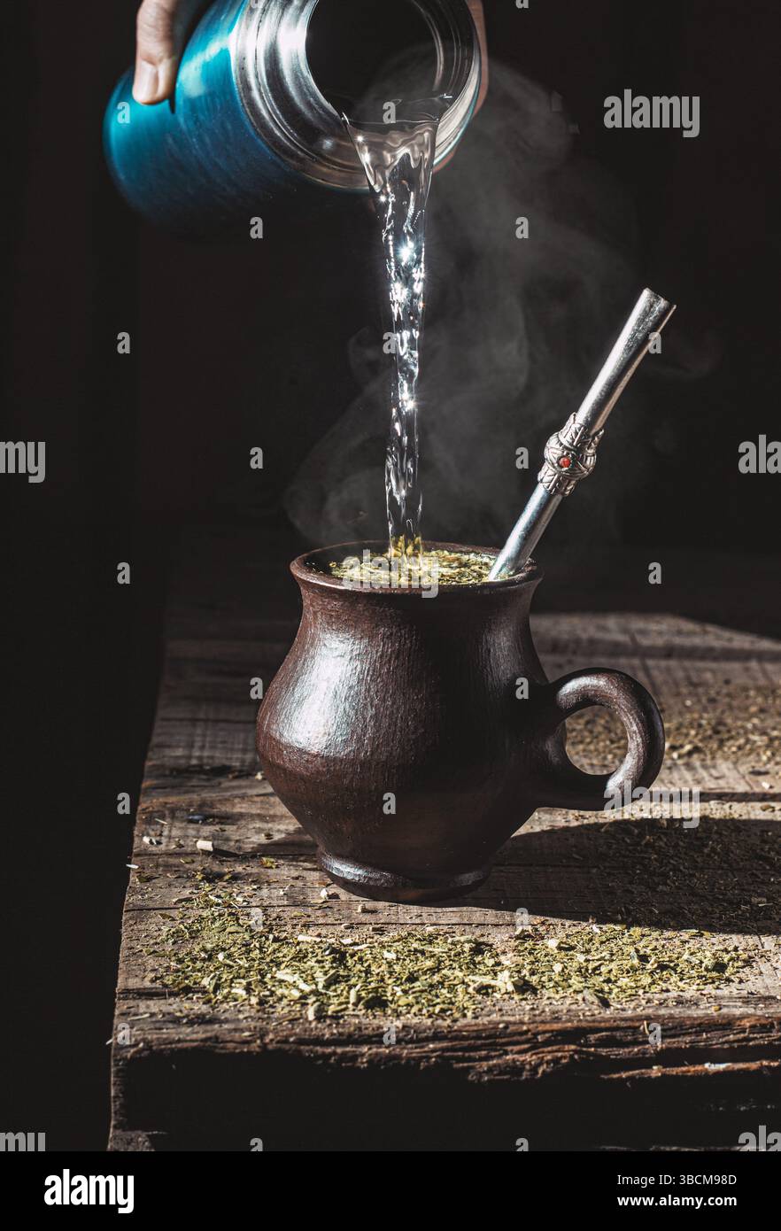 Water served in a steaming infusion of yerba mate, on a rustic table ...