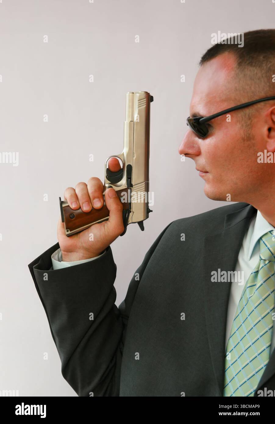 profile view contractor private security draw pistol in hand, bodyguard ...
