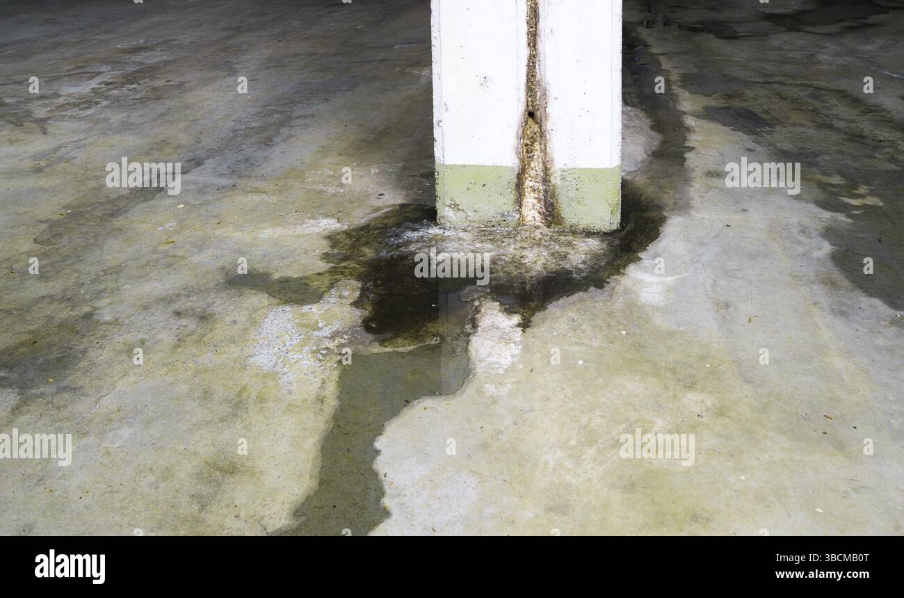 water damage in concrete construction with calcium and rust deposits ...