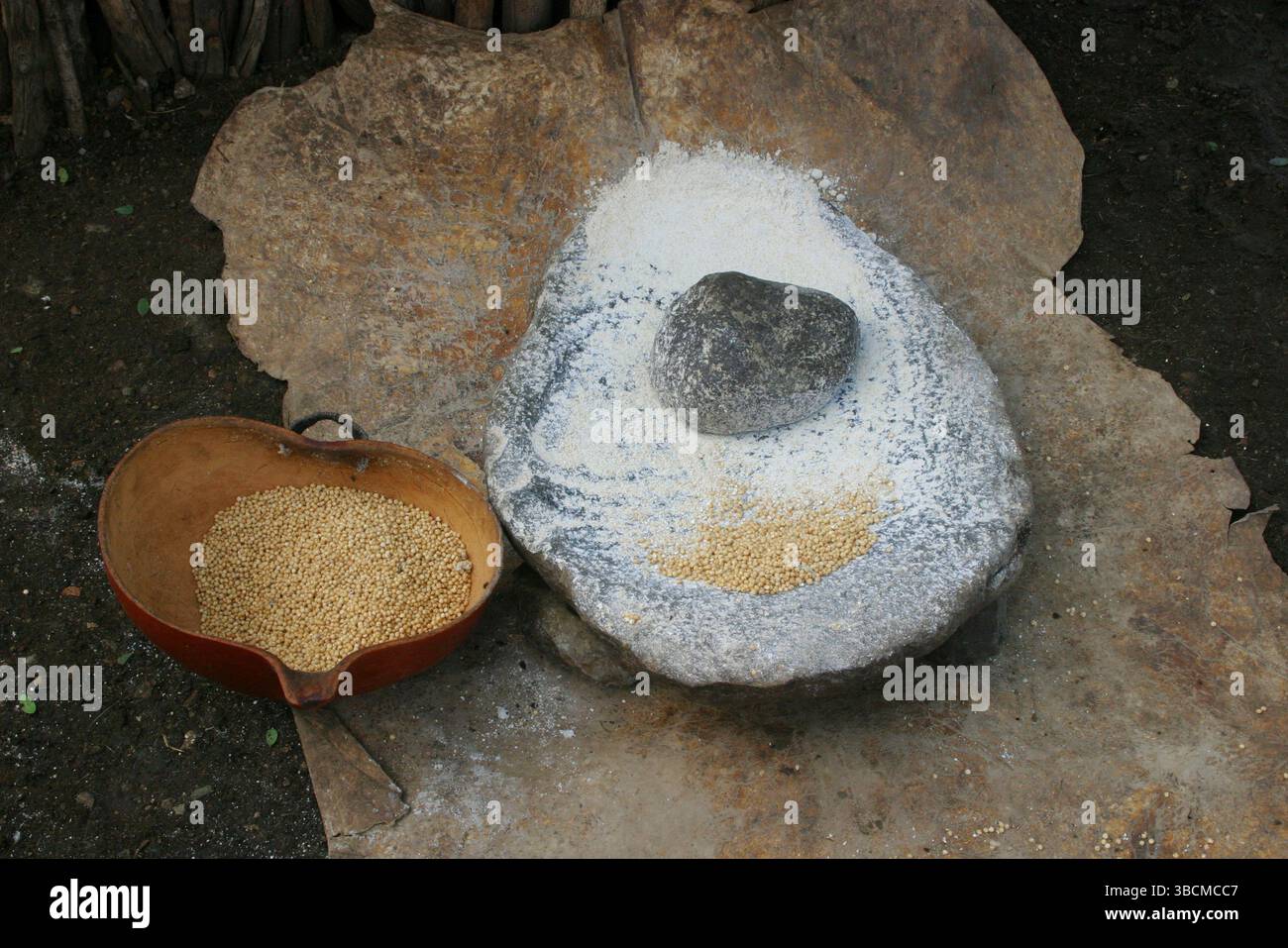 Grinding (Sorghum) Stone and Calabash with millet on cow hide, Grinding ...