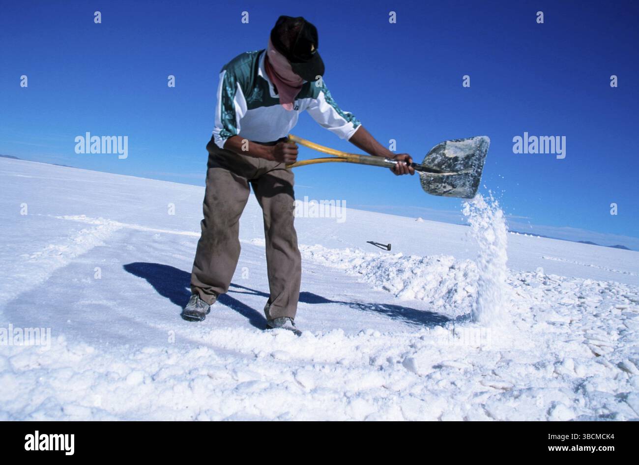 Man at salt production at salt lake, Salar de Uyuni, Bolivia, Man at ...