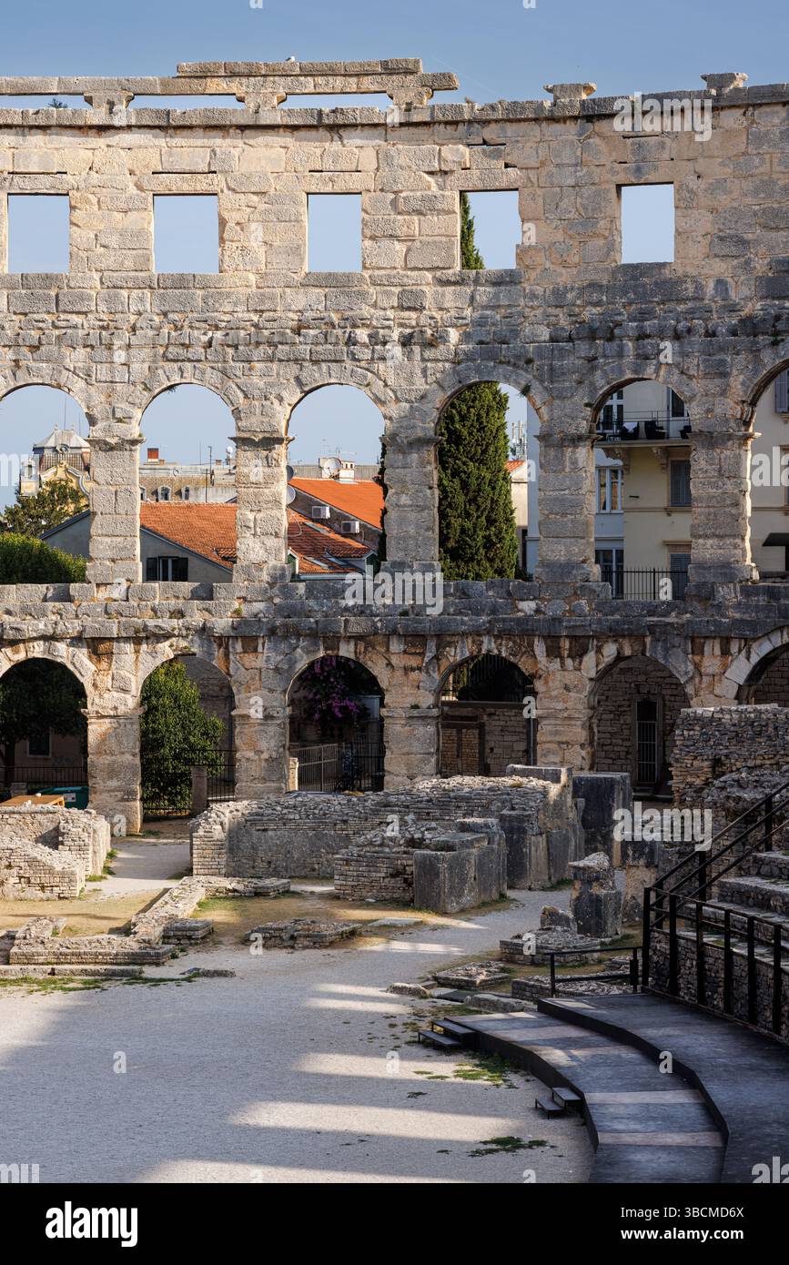 Ancient heritage in Pula, Istria, Croatia. Arches of monumental ancient ...