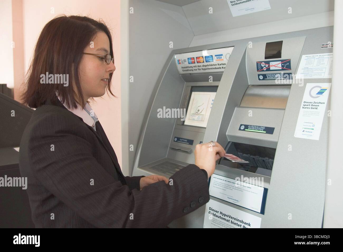 Woman at an ATM, Cash Point, Bank, Germany, Europe Stock Photo - Alamy