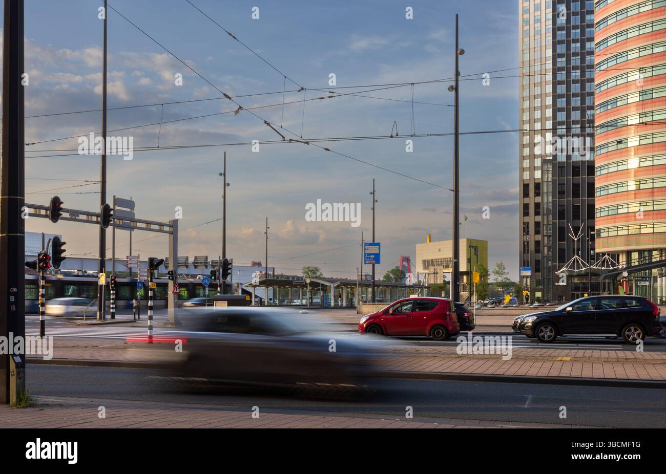 Rush hour traffic passes through a busy junction in central Rotterdam ...