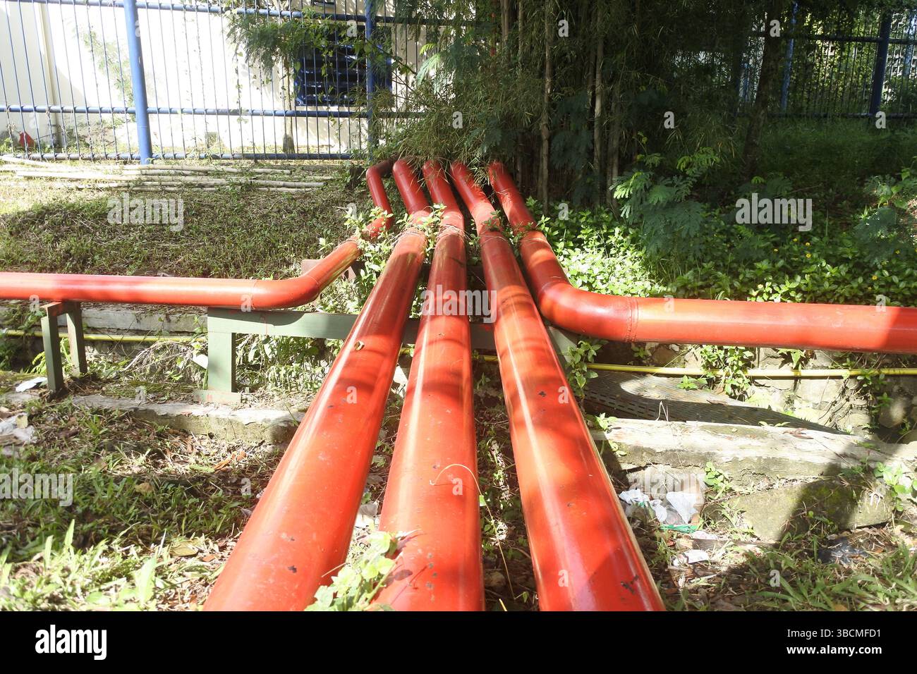 The hydrant iron pipe painted red is a water installation for ...