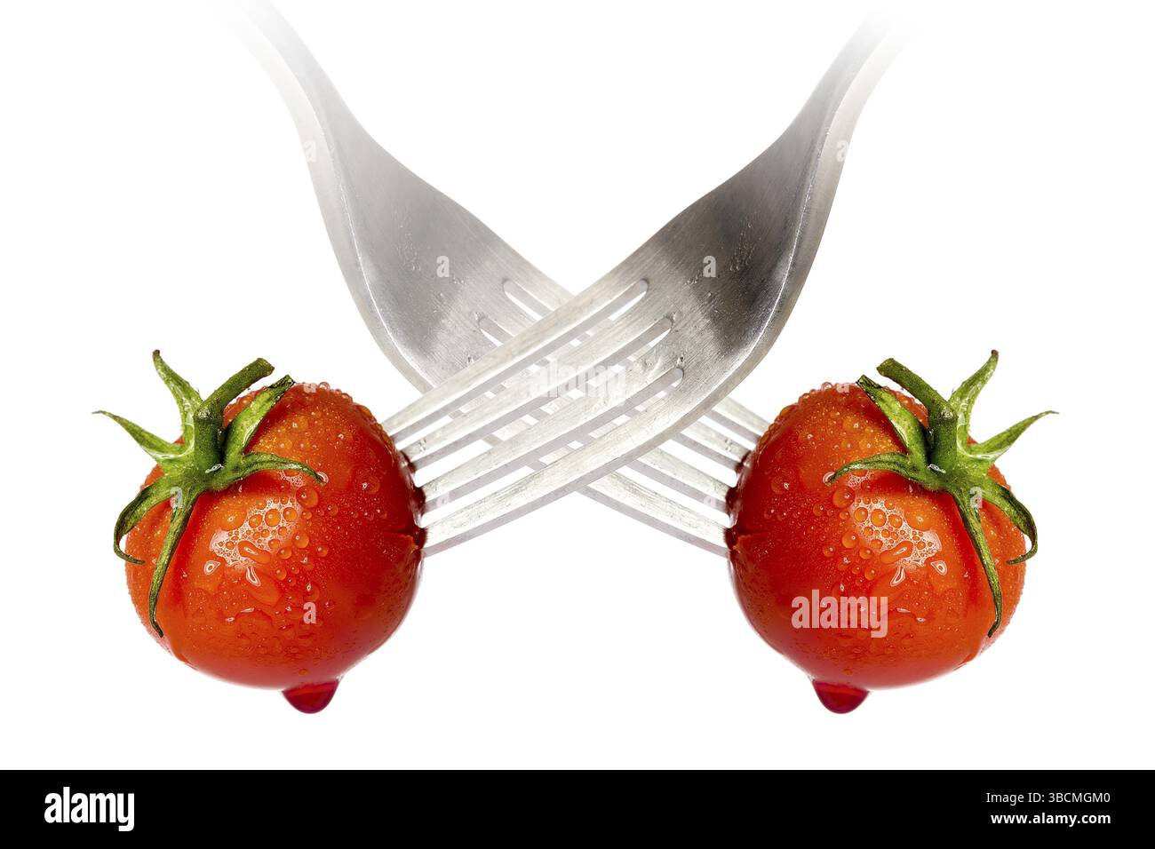 Cherry tomato spiked by a fork with reflection, isolated on white Stock ...