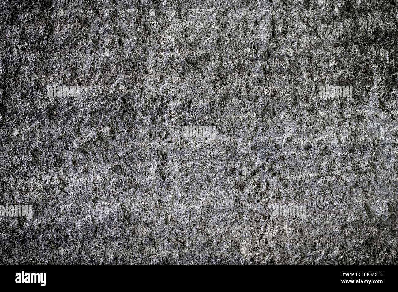 Natural stone granite wall with rough structure Stock Photo - Alamy