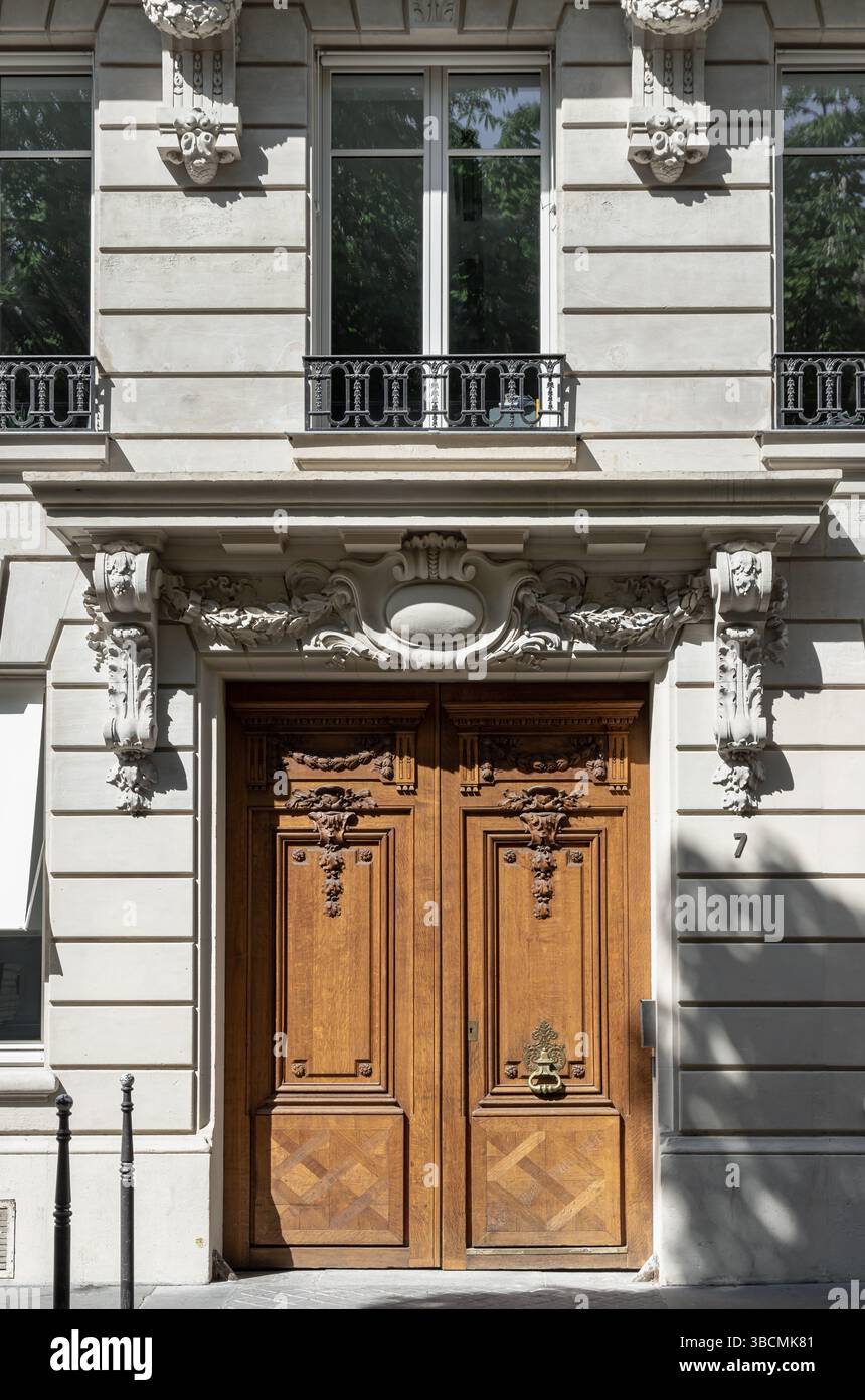France, Paris - May 03, 2025 - Magnificent entrance facade brown door ...