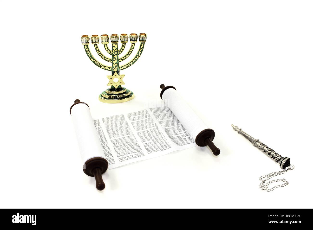 Torah scroll with menorah and Torah pointer on a light-coloured ...
