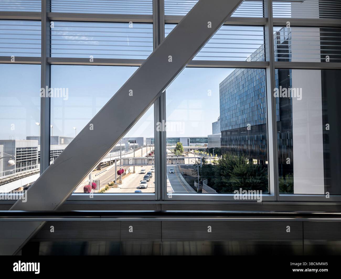 Minneapolis Saint Paul Airport’s terminal, framed by large windows and ...