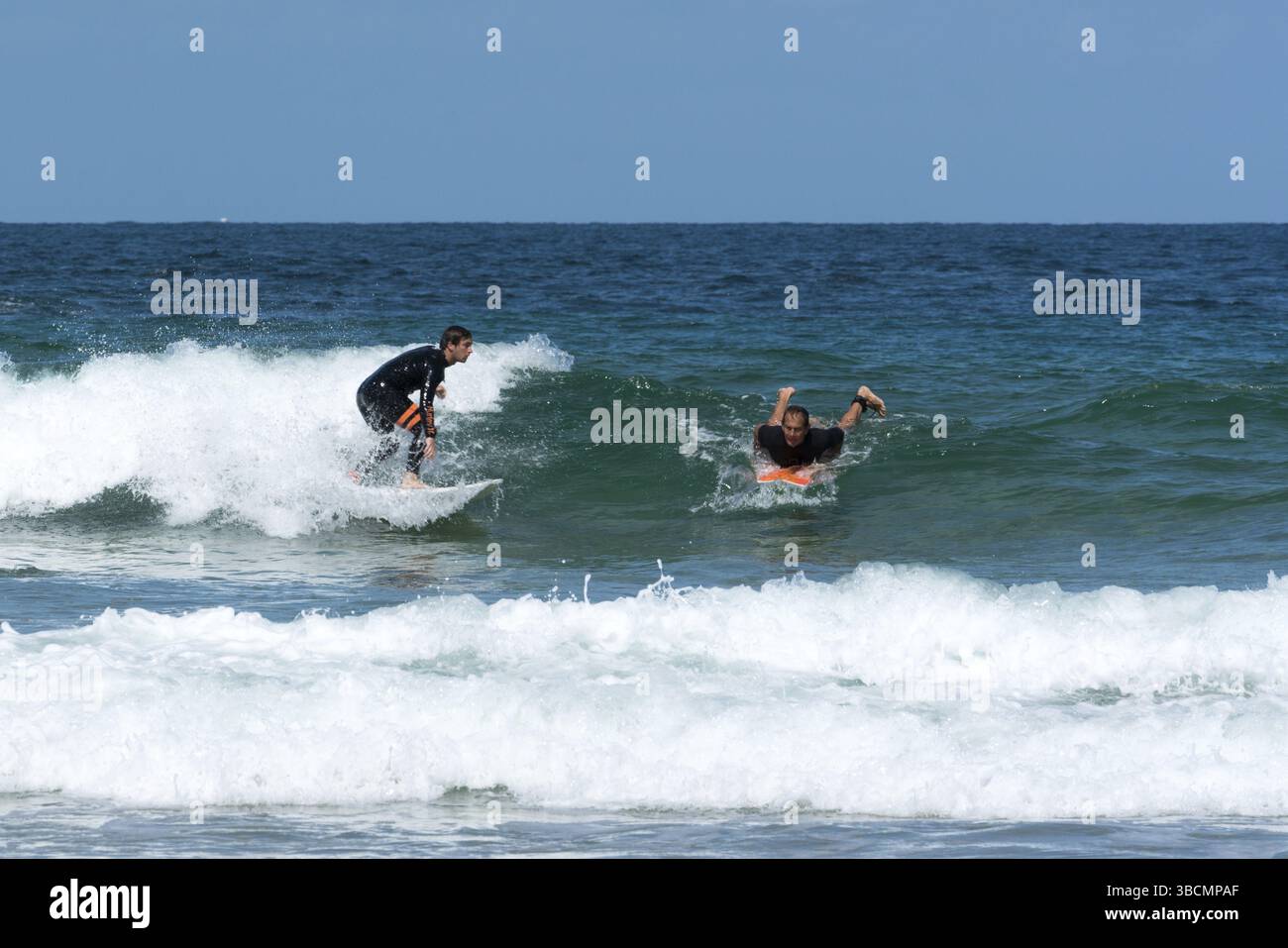 Surfer cutting through a wave hi-res stock photography and images - Alamy