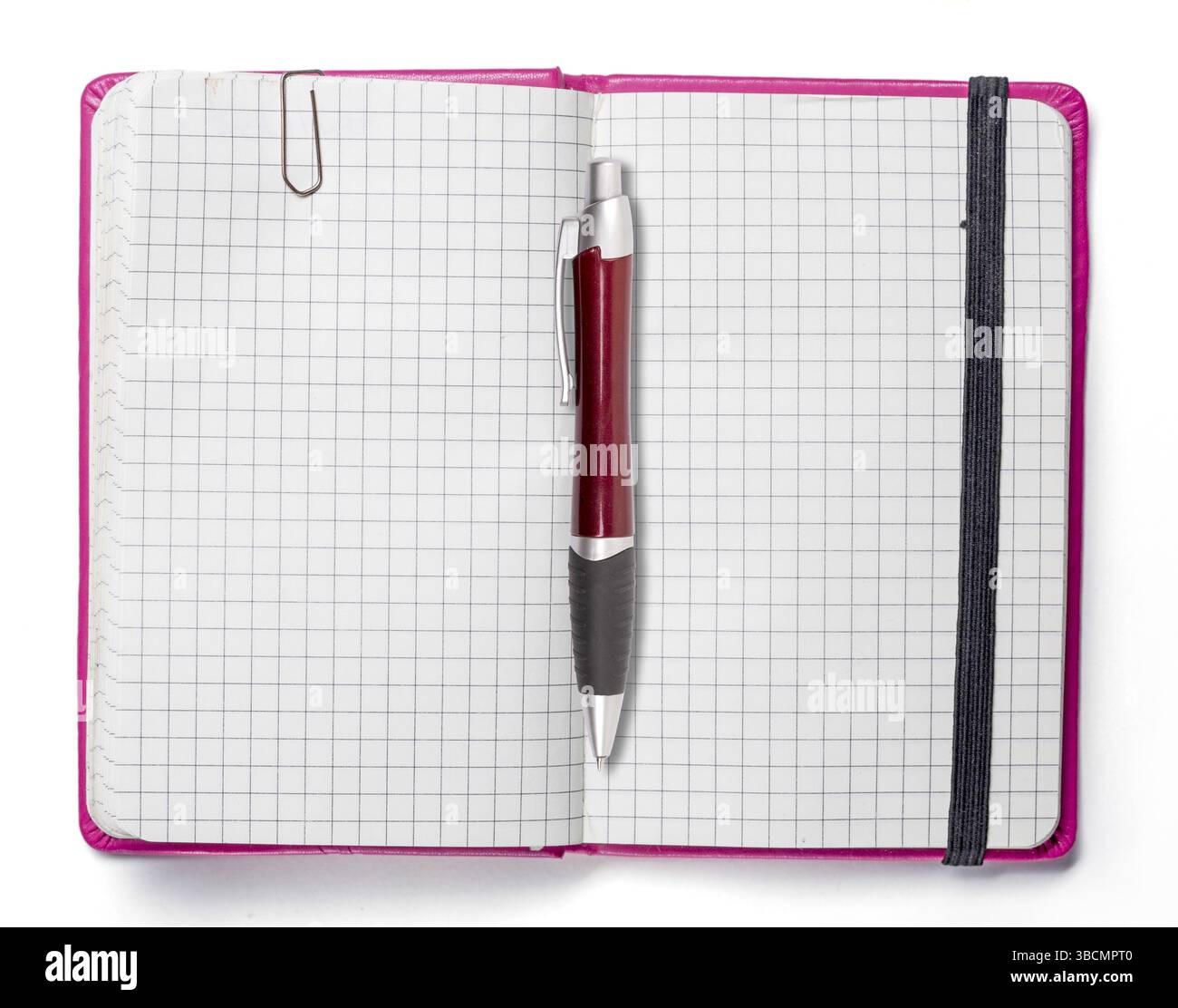 Blank page of pink note book with paper clip and elastic strap and a ...