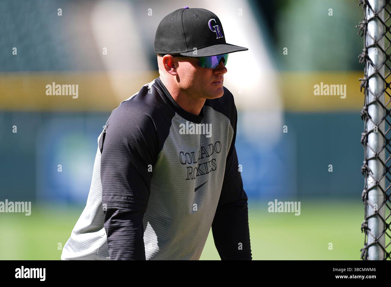 Colorado Rockies interim manager Warren Schaeffer looks on as players ...