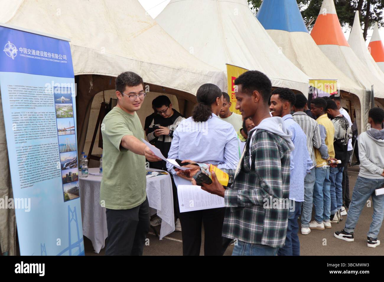 Addis Ababa, Ethiopia. 19th May, 2025. A Chinese employer talks to an ...
