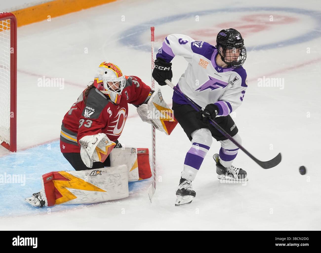 Minnesota Frost forward Brooke McQuigge tries to deflect a puck past ...