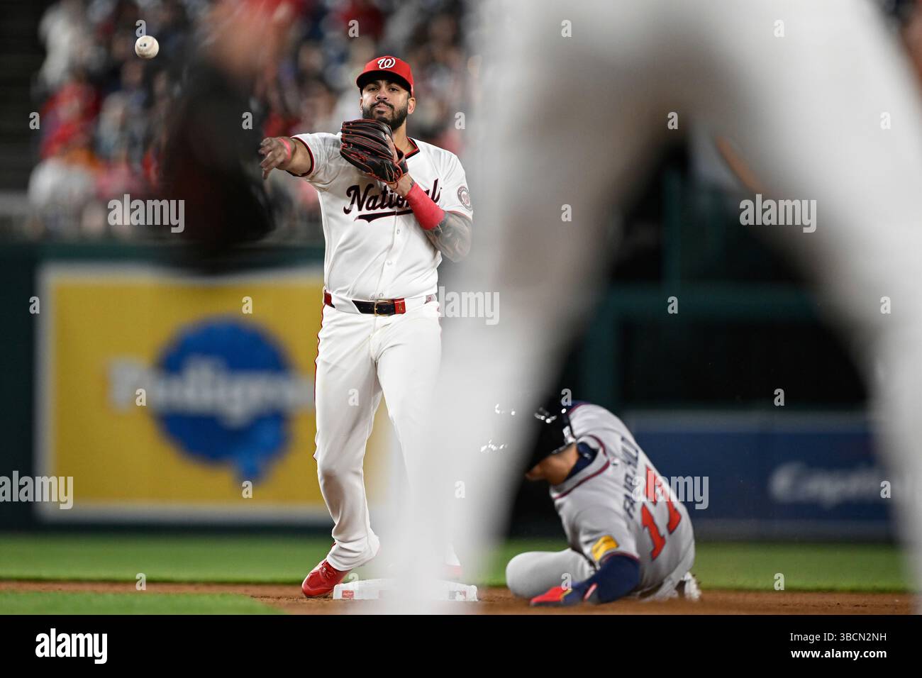 Washington Nationals second baseman Luis García Jr. gets the force out ...