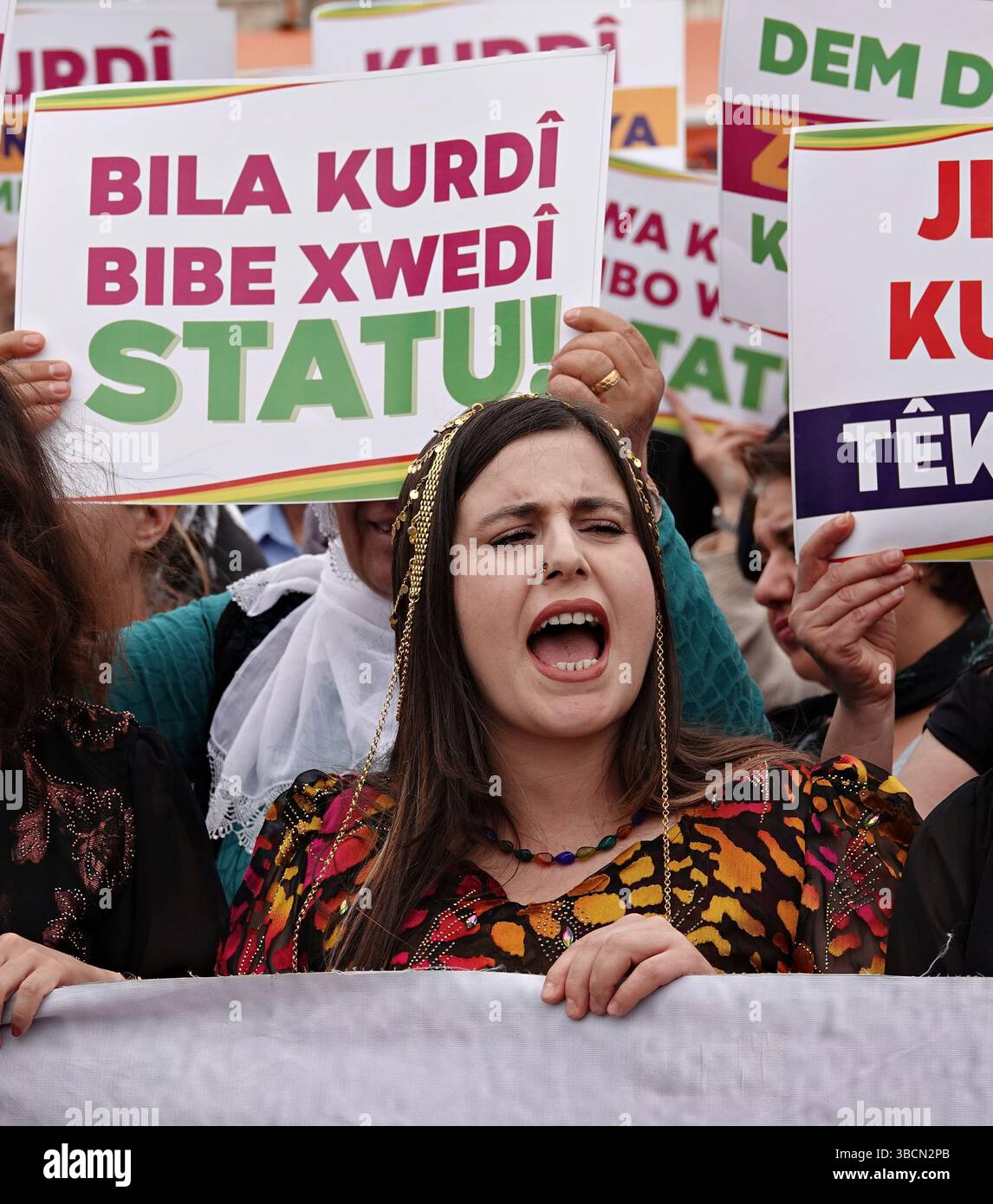 Diyarbakir, Turkey. 20th May, 2025. A Kurdish woman is seen chanting slogans during a march. The ...