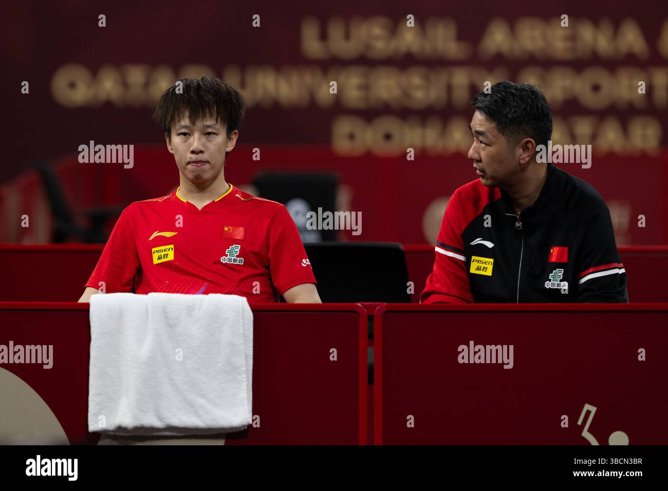 Doha, Qatar. 20th May, 2025. Lin Gaoyuan (L) listens to his coach Liu ...