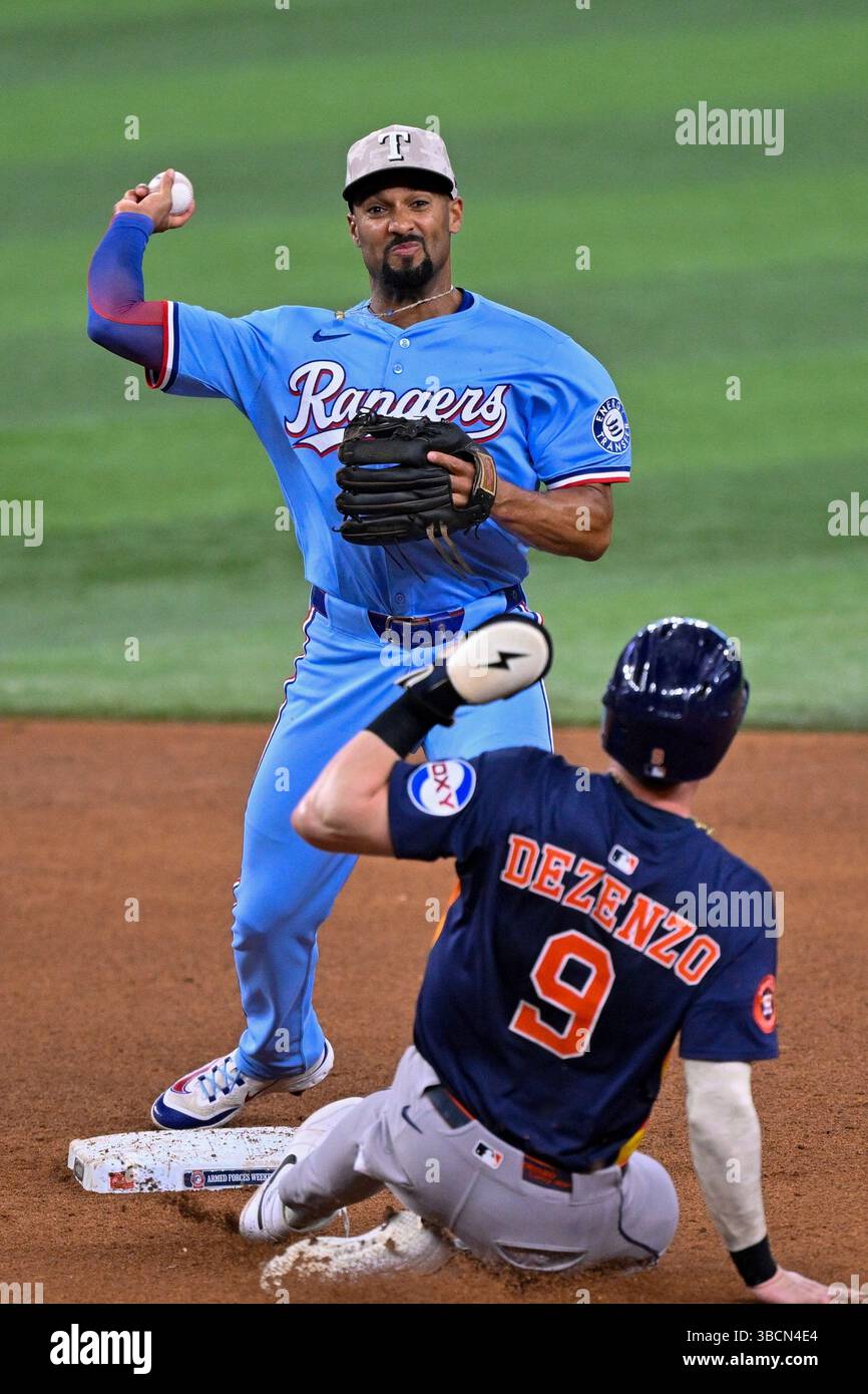 Texas Rangers second baseman Marcus Semien (2) throws to first base as ...