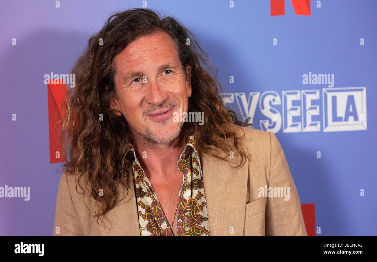 Ian Brennan poses at a photo call for the Netflix series "Monsters: The ...