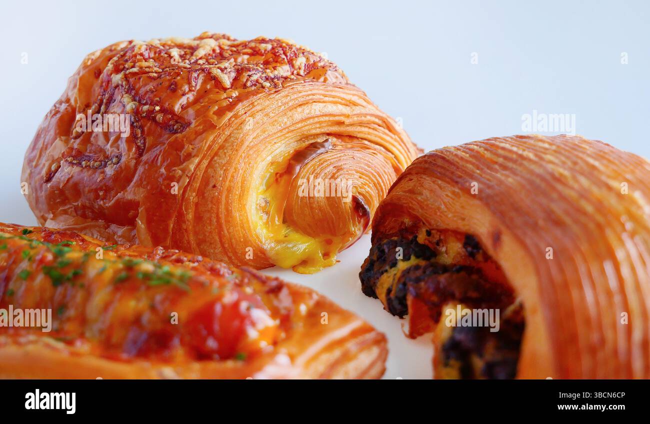 Close up Fresh baked appetizing various kind of croissants, pastry ...