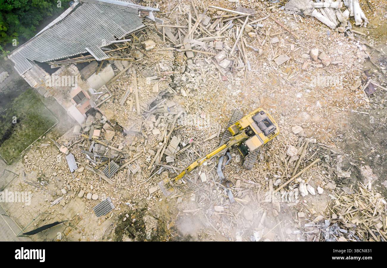 pile of bricks and boards from a destroyed building at a demolition ...