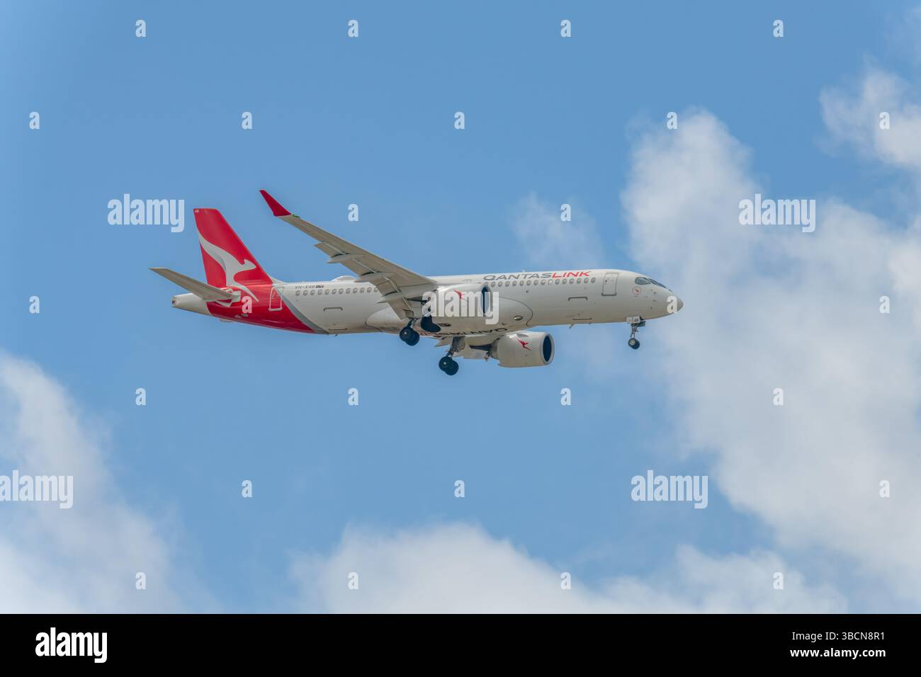 VH-X4B - Airbus A220-300 - QantasLink Aircraft in the blue sky with ...