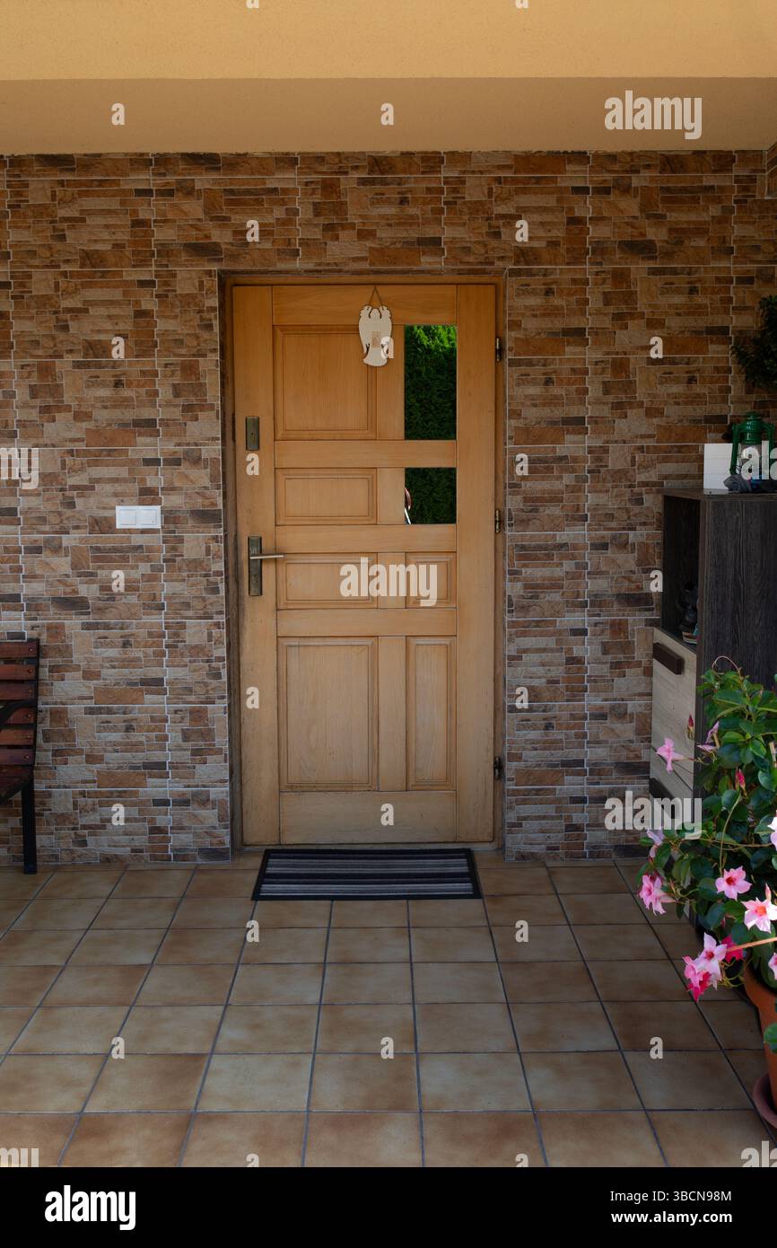 A front door detail with a stone accent wall, modern and luxury door ...