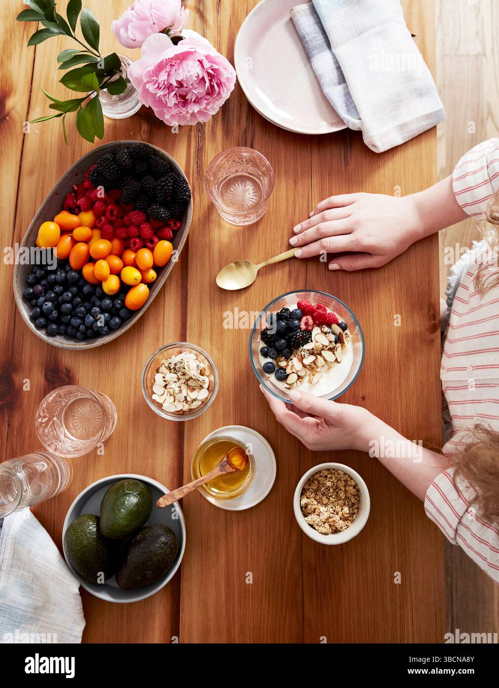 Healthy breakfast setup with yogurt, fruit, granola, and honey Stock ...