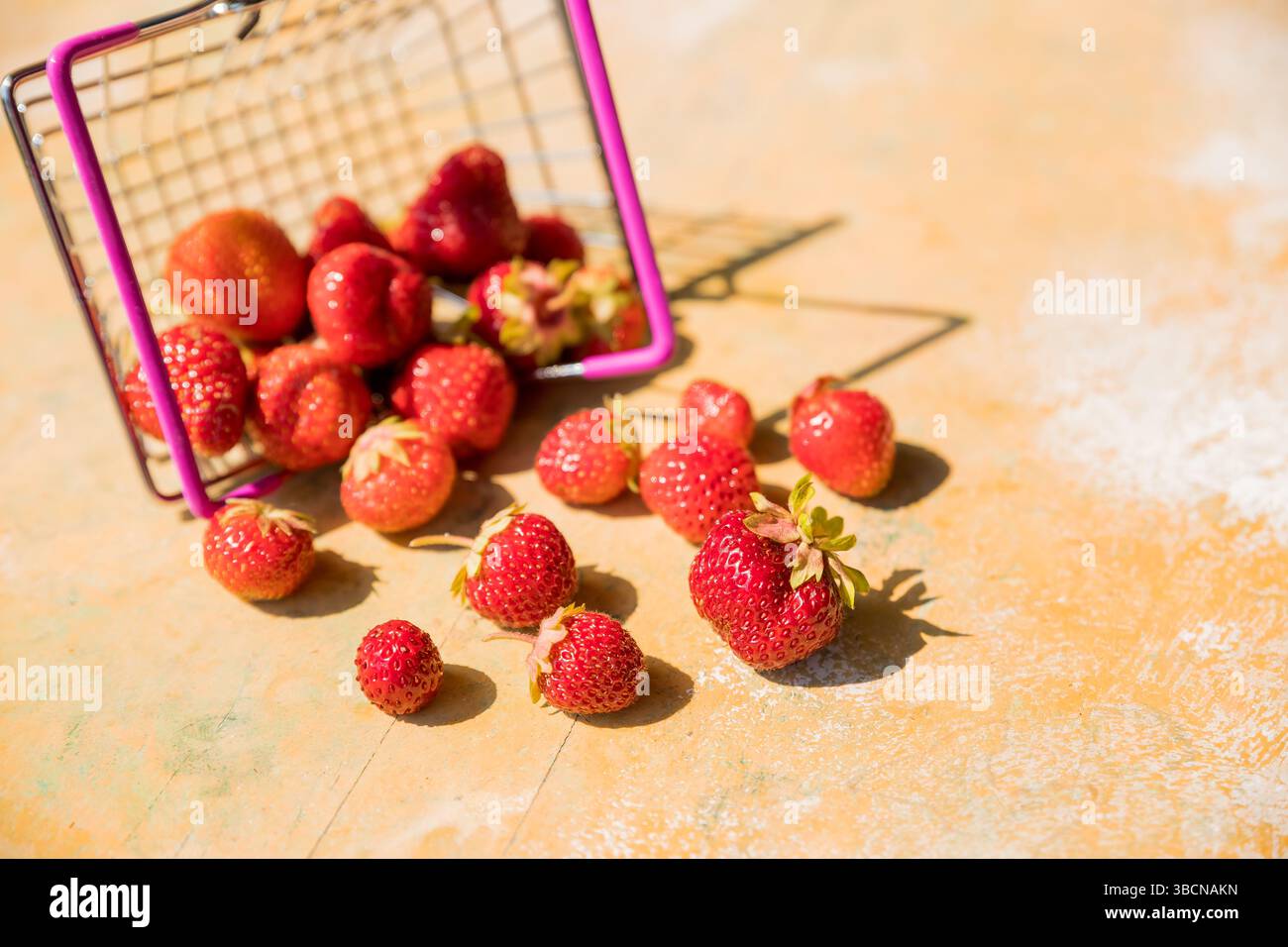 Strawberry, shopping trolley in which red ripe strawberries, and one ...