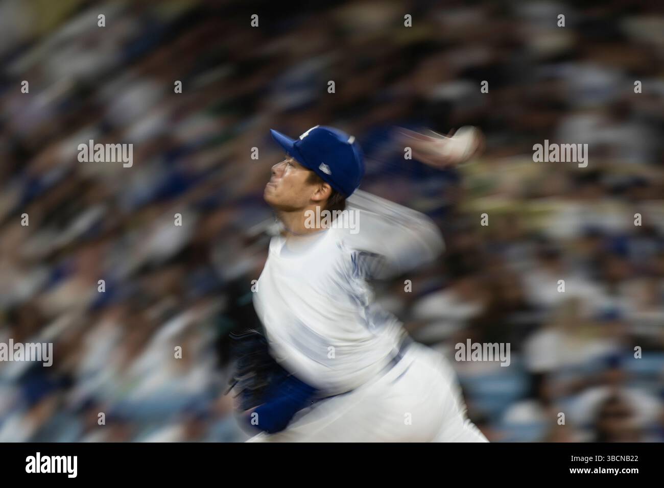 Los Angeles Dodgers starting pitcher Yoshinobu Yamamoto delivers a ...