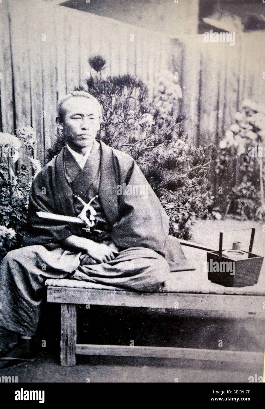 Old black & white photo of Sakamoto Ryoma posing in a studio, one of a ...