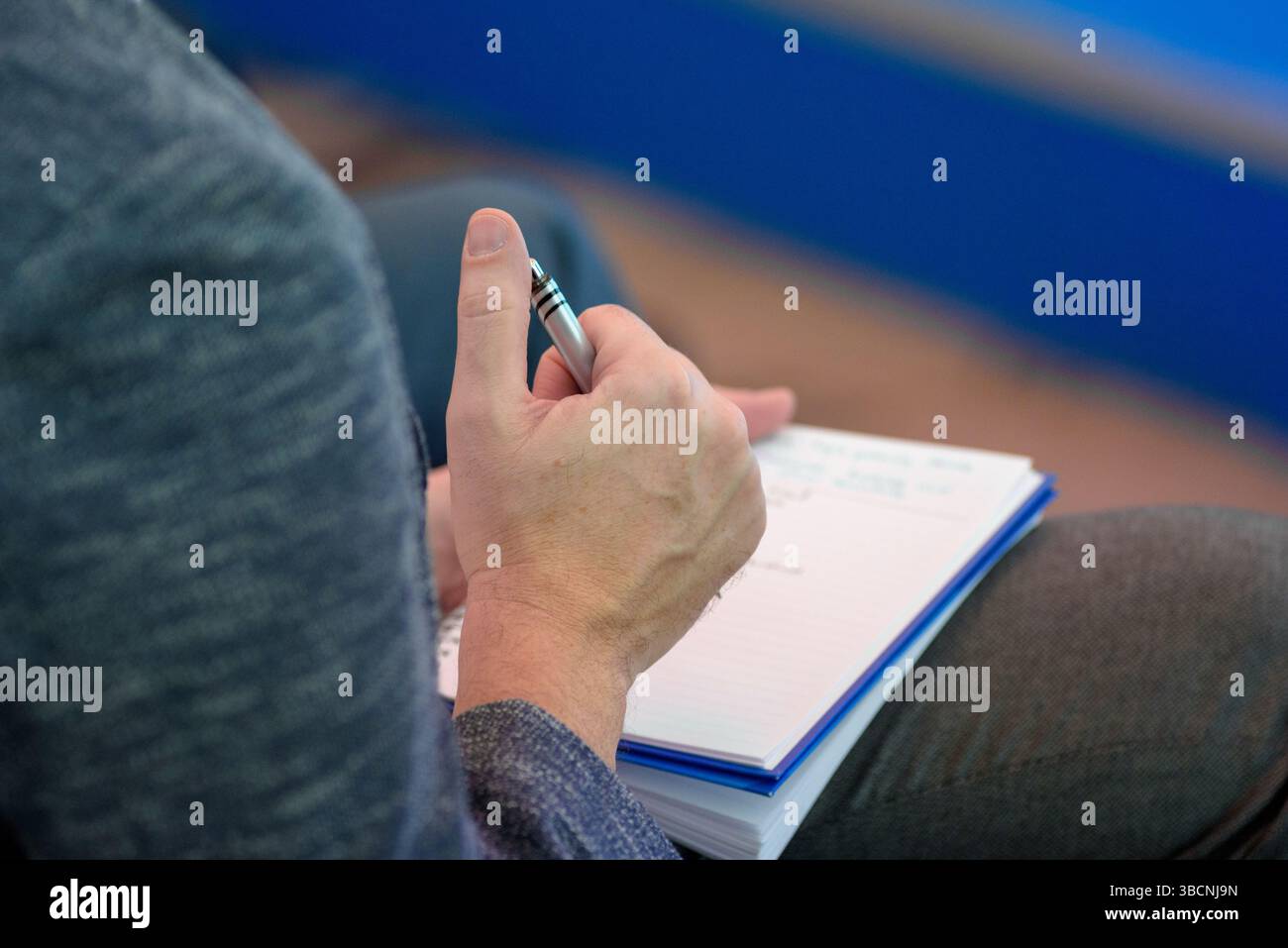 Taking notes during business meeting Stock Photo - Alamy